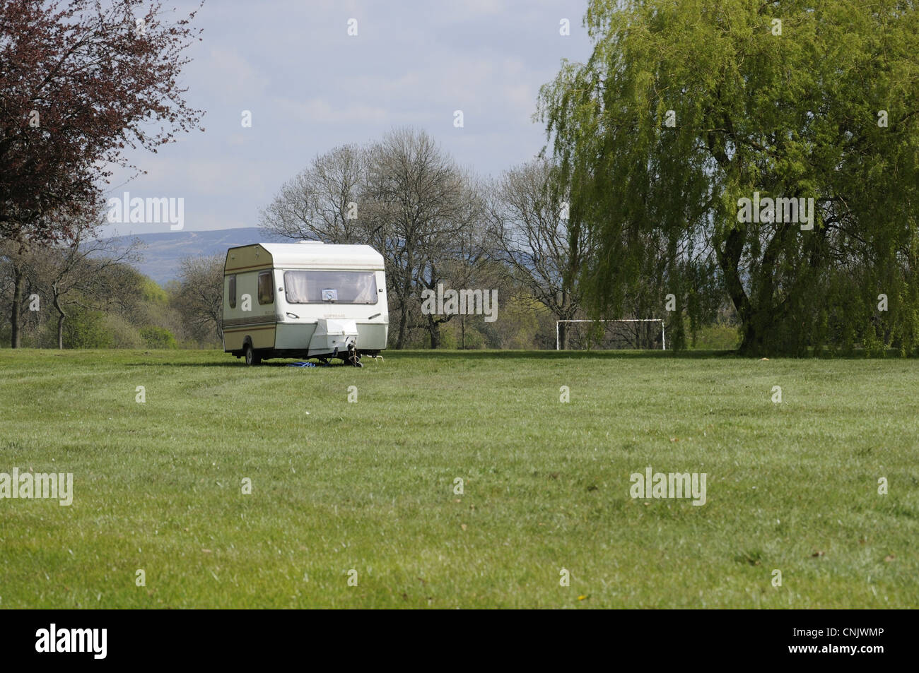 Caravan parked on Debdale Park in Gorton before the funfair sets up ...