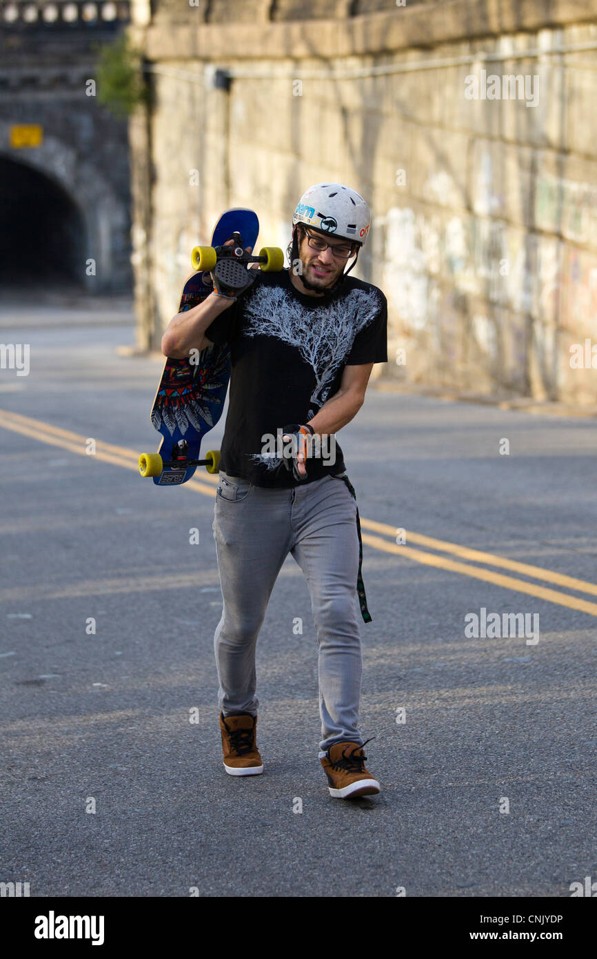 Young male skateboarder on urban street Stock Photo - Alamy