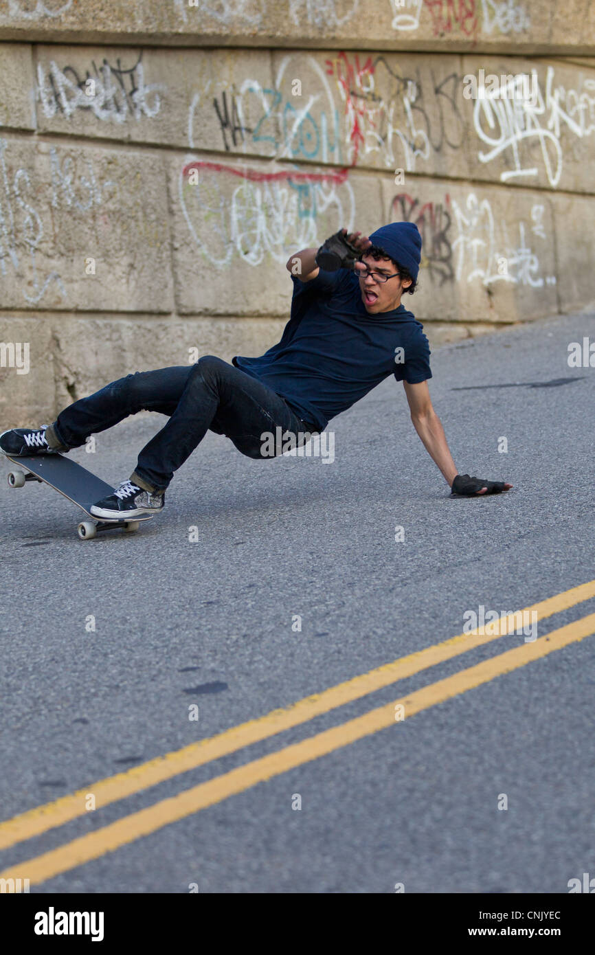 Young male skateboarder on urban street Stock Photo - Alamy