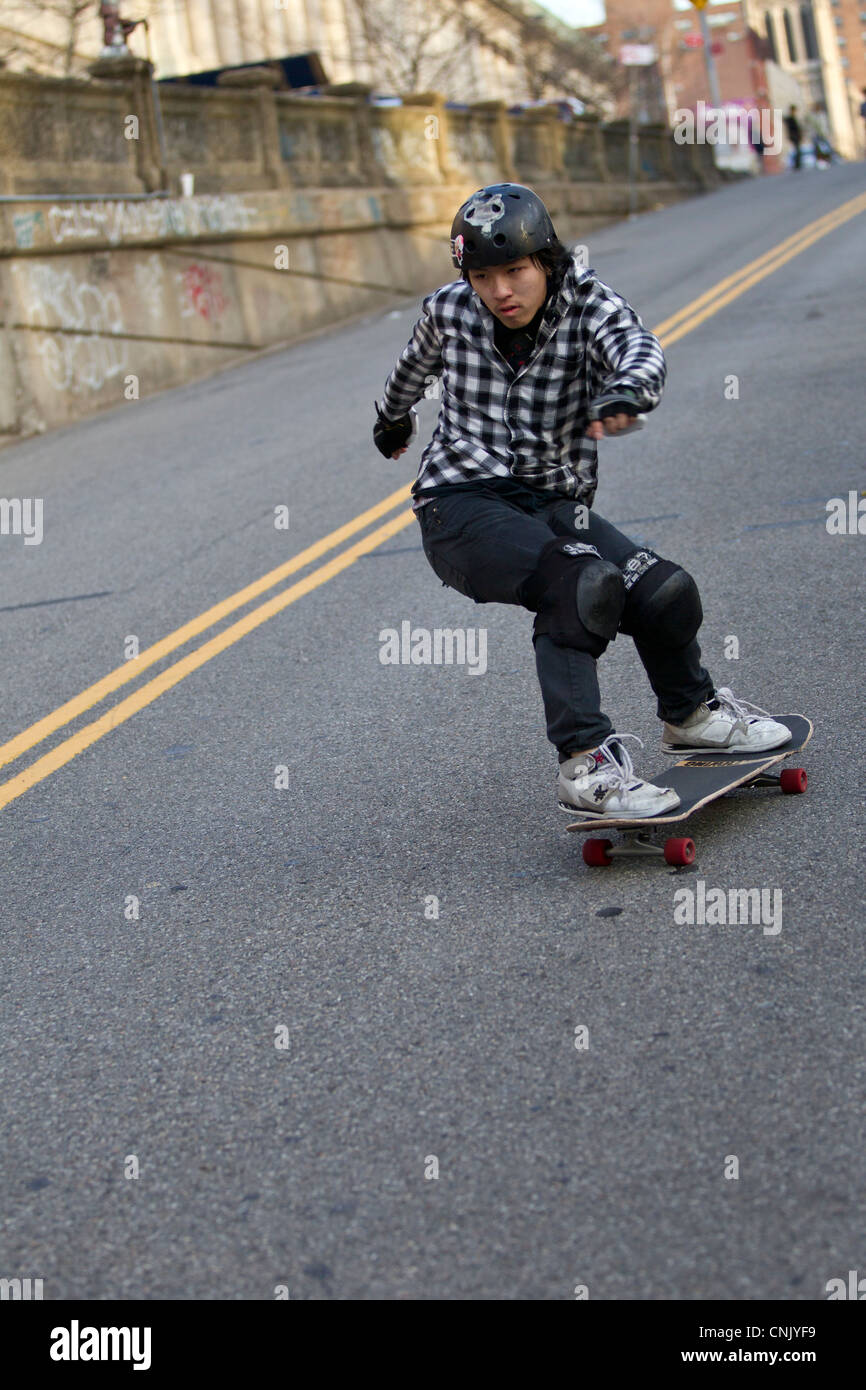 Young male skateboarder on urban street Stock Photo - Alamy
