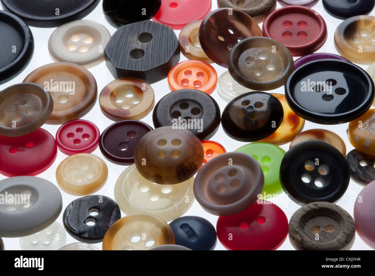 A range of different sized and coloured buttons Stock Photo - Alamy