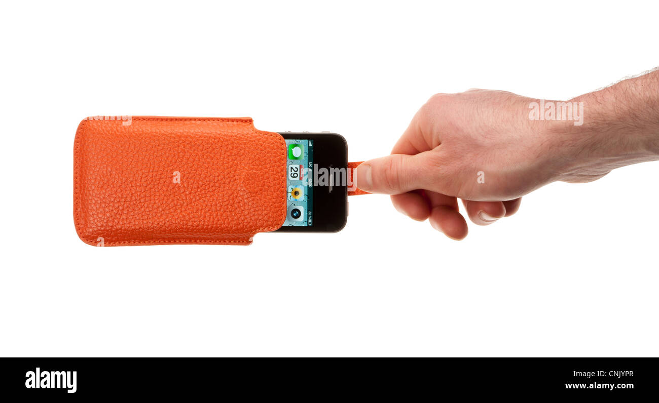Hand pulling mobile/cell phone from its leather case Stock Photo - Alamy