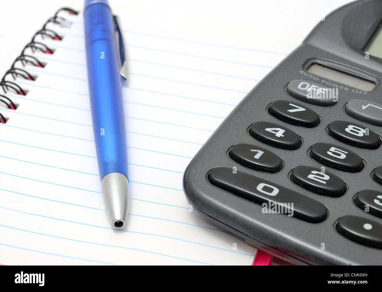 Calculator, pen and note pad at the office Stock Photo - Alamy
