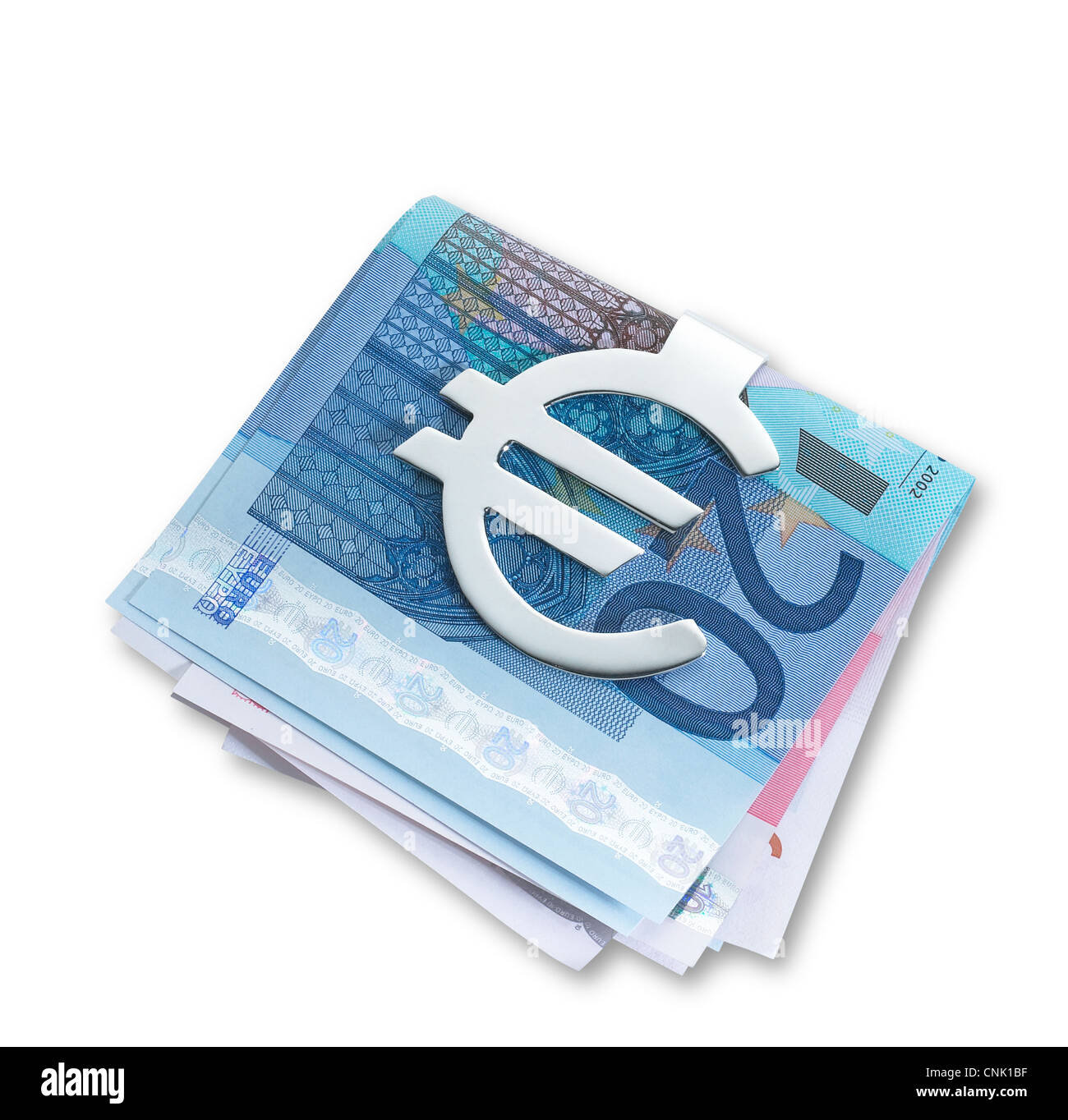 a silver euro money clip and folded euros with clipping path at an ...
