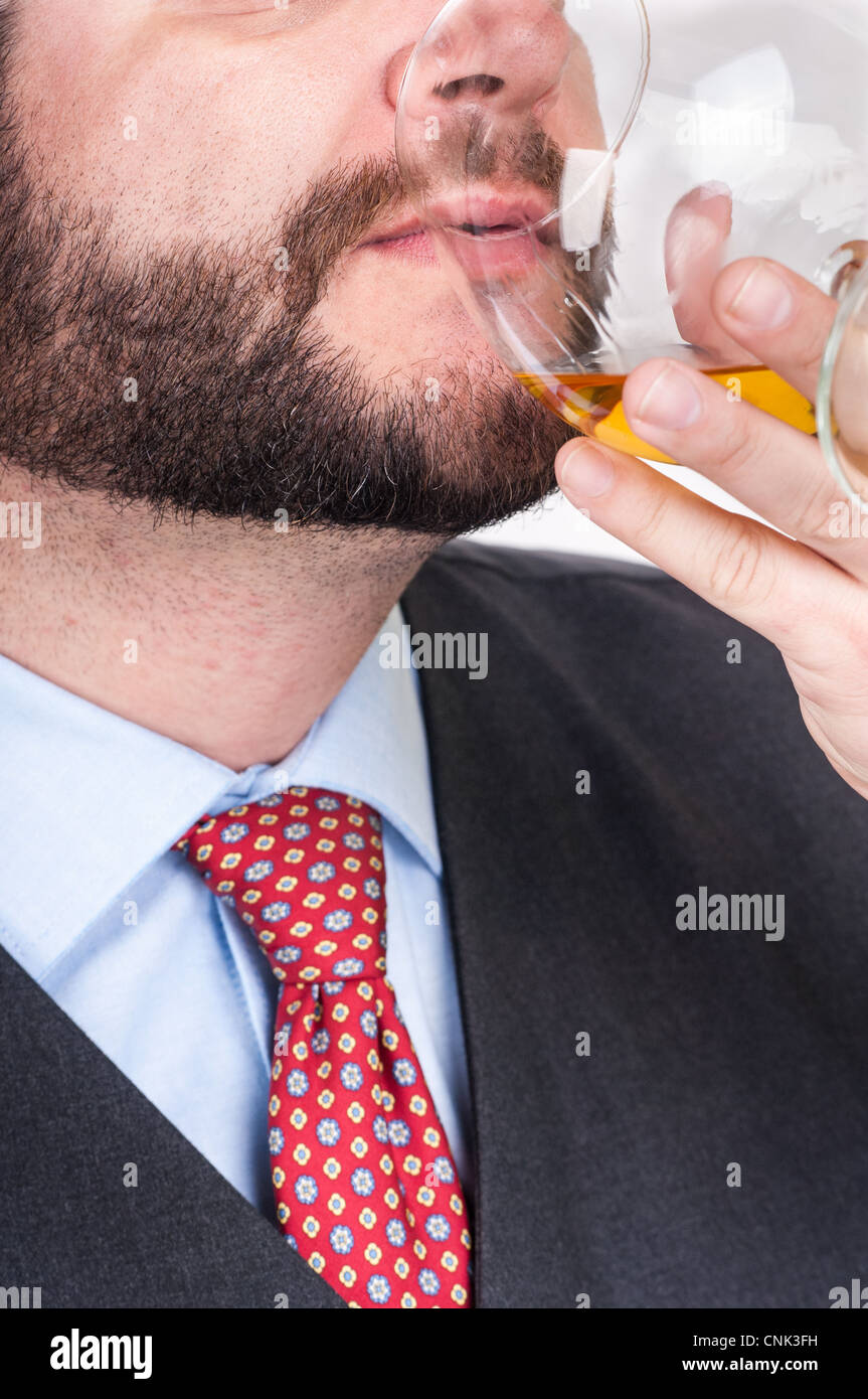 Drunk Businessman Drinking from a Bottle of whiskey Stock Photo - Alamy