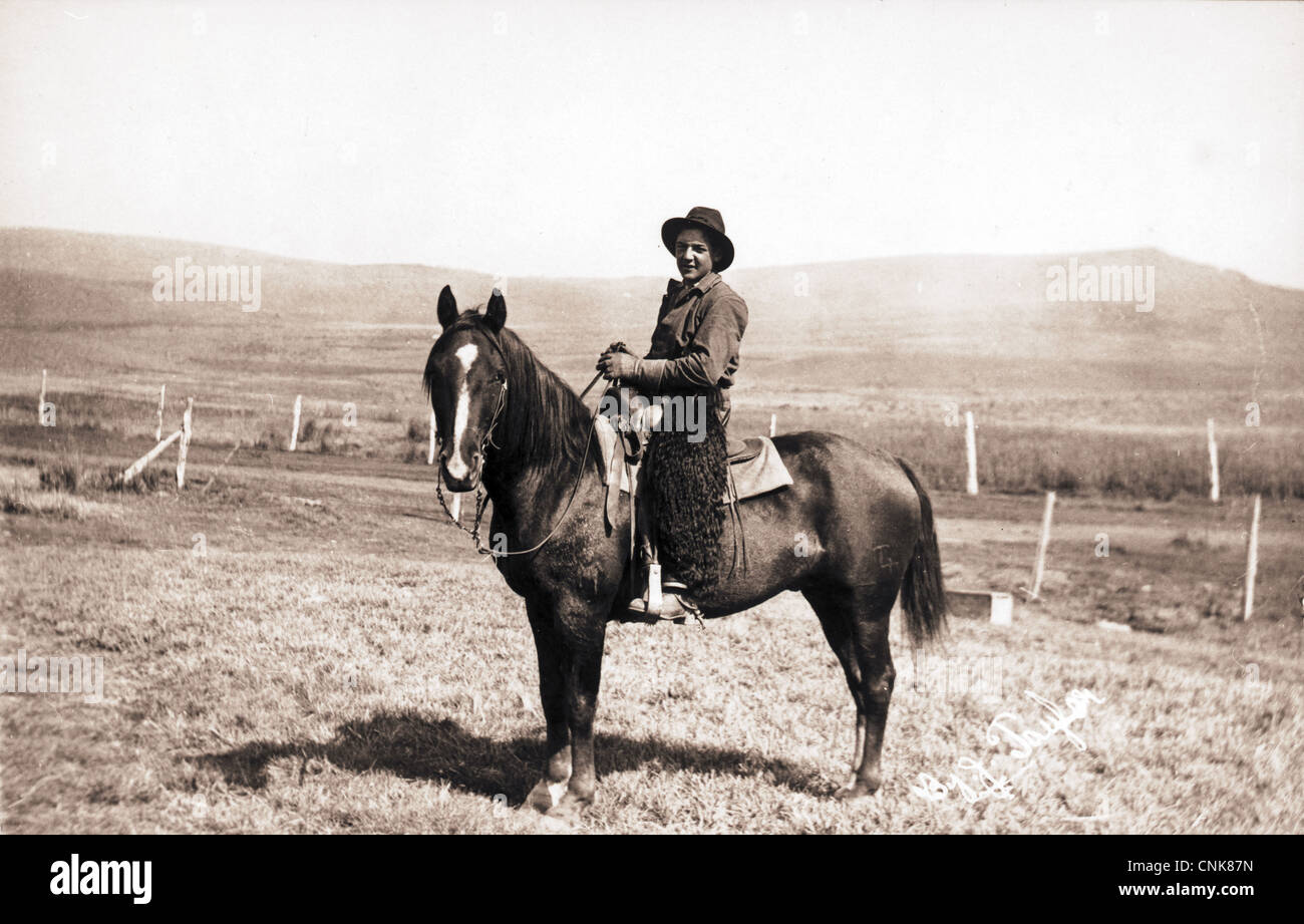 Small Cowboy on Horseback in a Field Stock Photo - Alamy