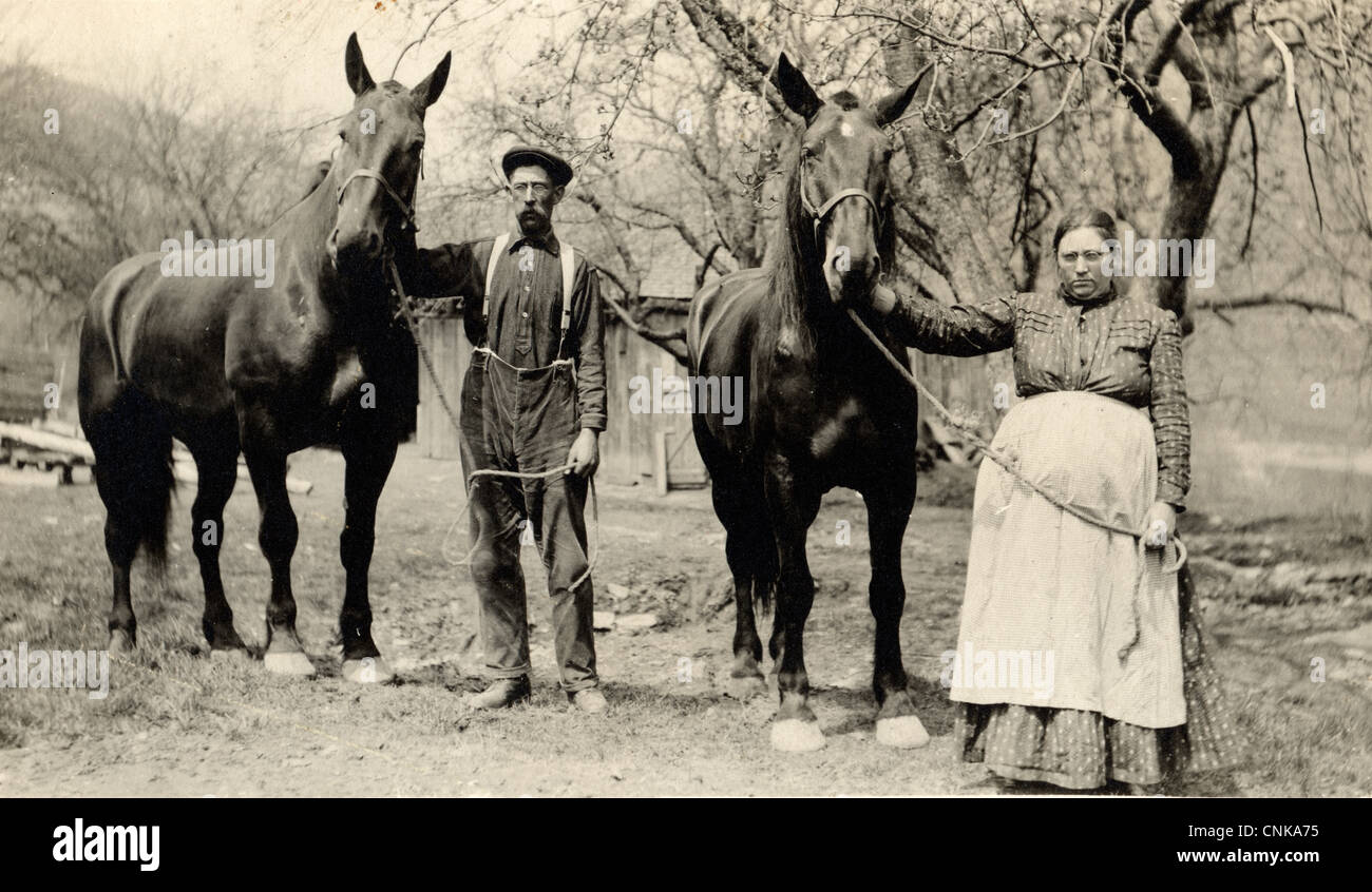 Middle Aged Farm Couple Each with a Horse Stock Photo - Alamy