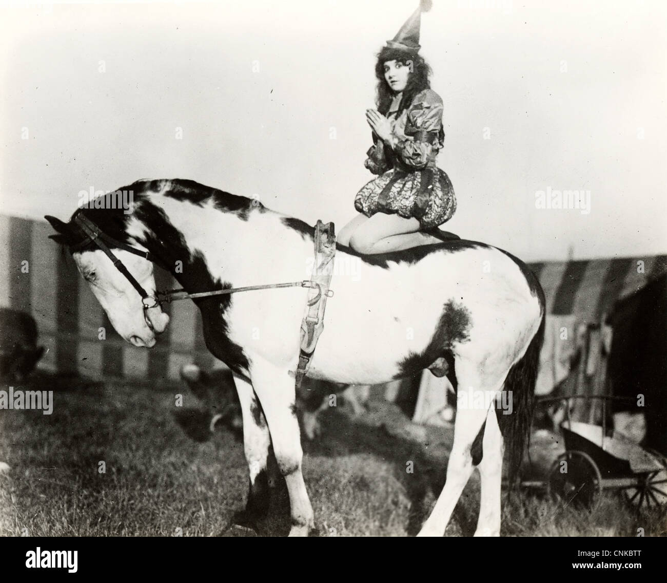 Circus Clown Girl Praying on Horseback Stock Photo - Alamy