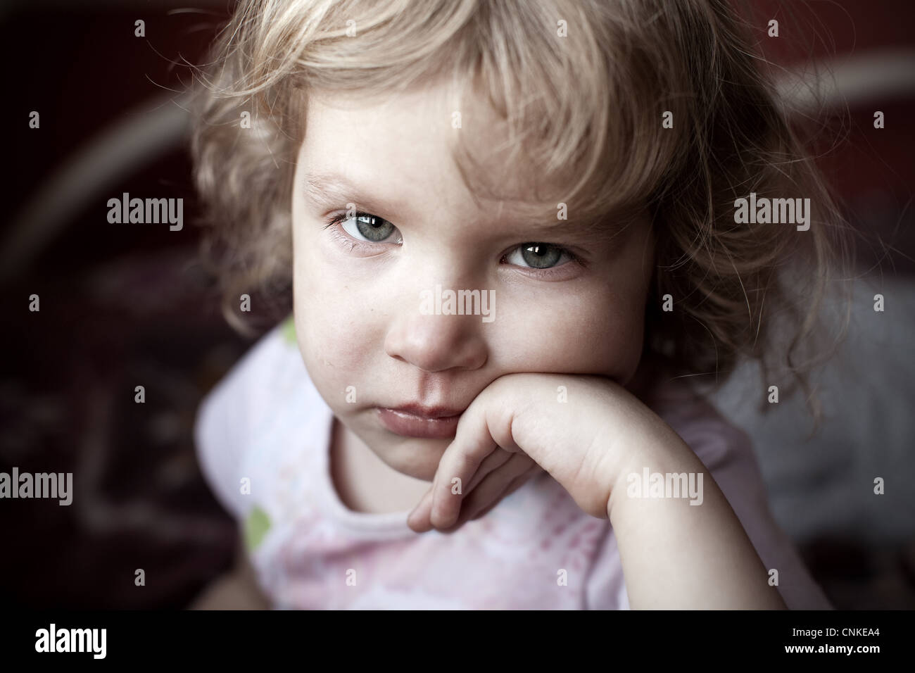 Sad little child looking at camera Stock Photo - Alamy