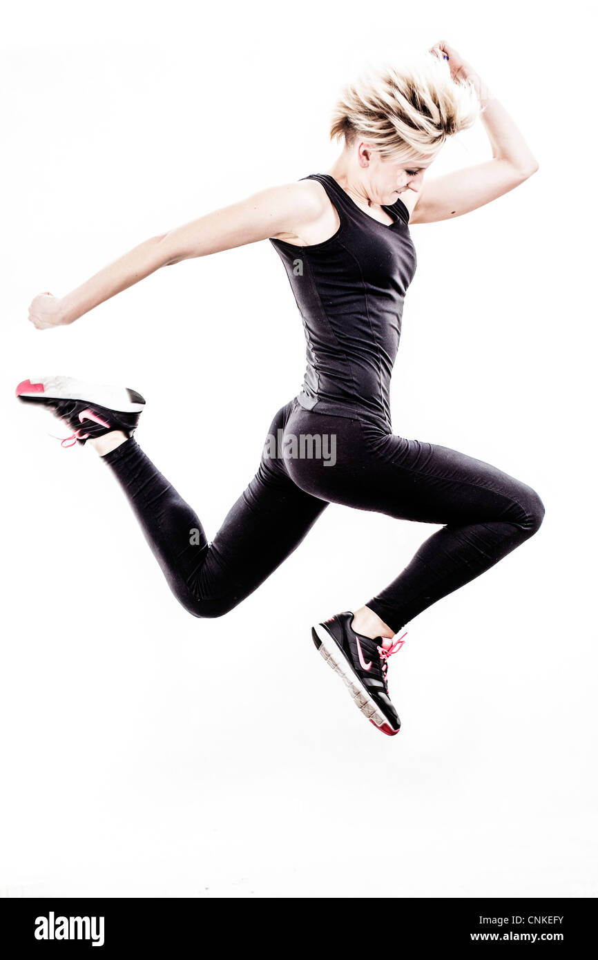 Woman exercising on white background Stock Photo - Alamy