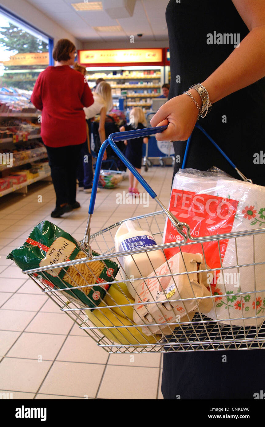 Female shoppers in petrol station Tesco Express convenience store UK ...