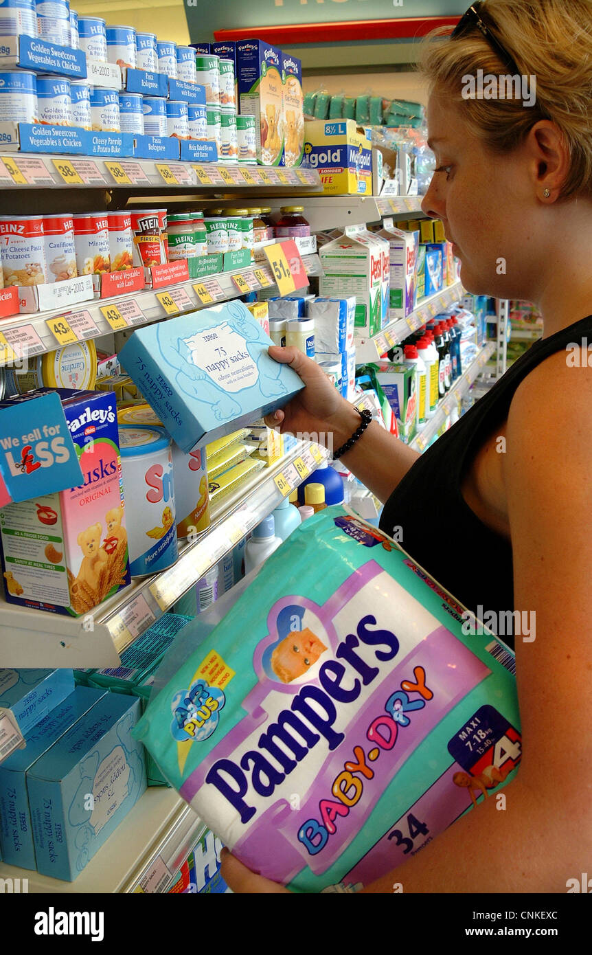 Female shoppers in petrol station Tesco Express convenience store UK ...