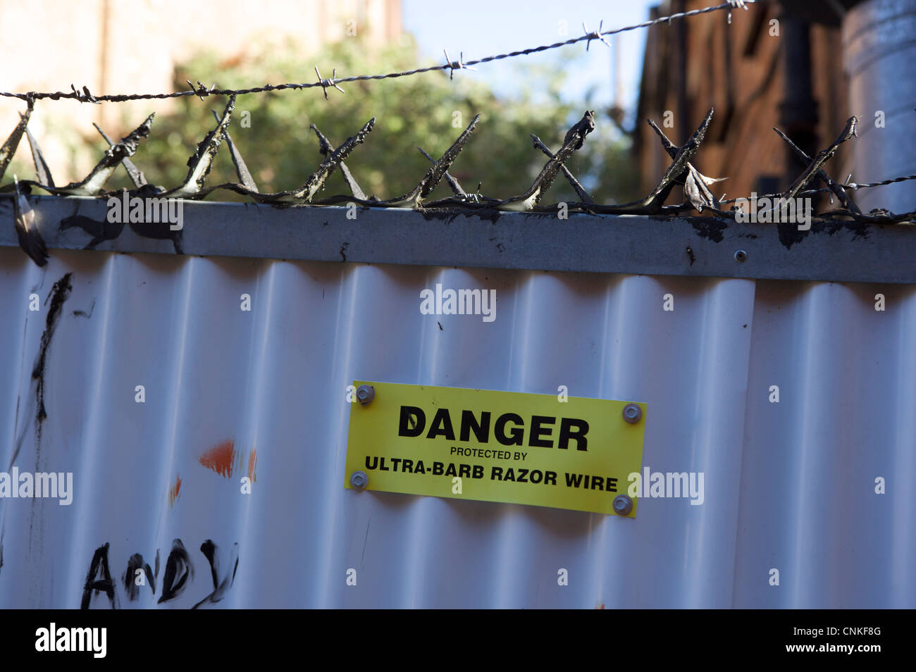 Danger ultra-barb razor wire Stock Photo - Alamy