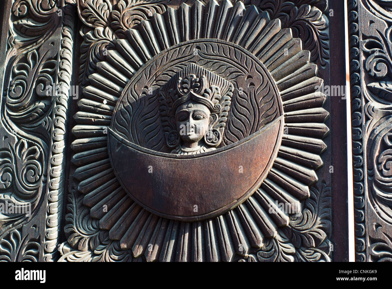 Fine wood carved gates with an image of sun and moon of a temple in ...