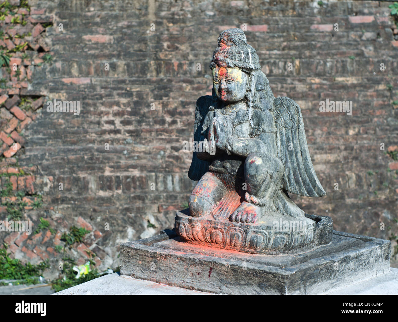 Holy sculpture of praying hinduism deity made from stone with hands in ...