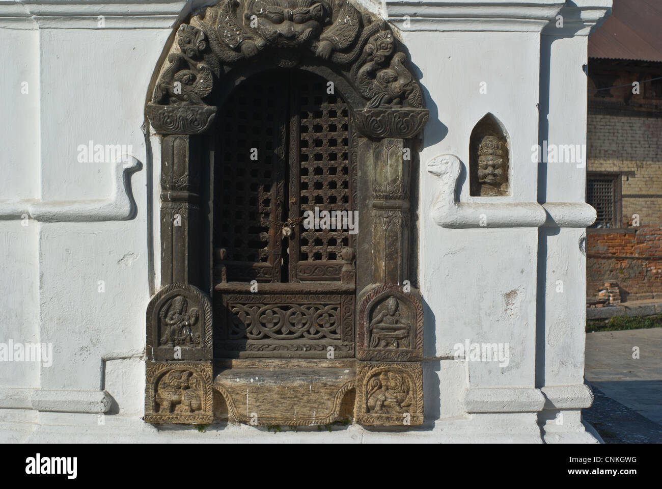 Traditional wood grill window shutters with carving in a hinduist ...