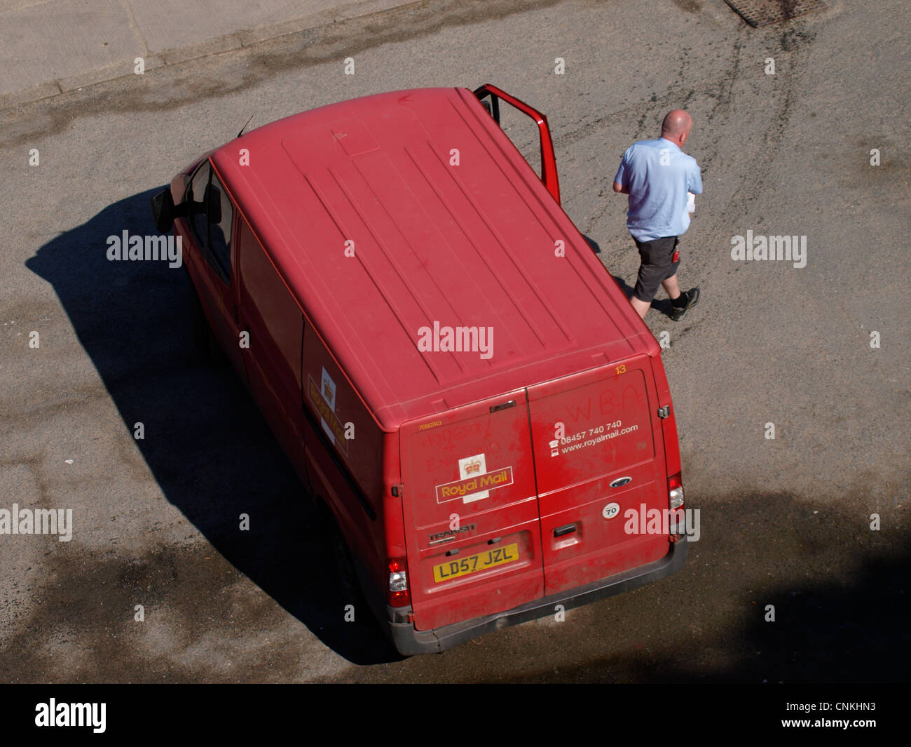Postman delivering letters, UK Stock Photo - Alamy