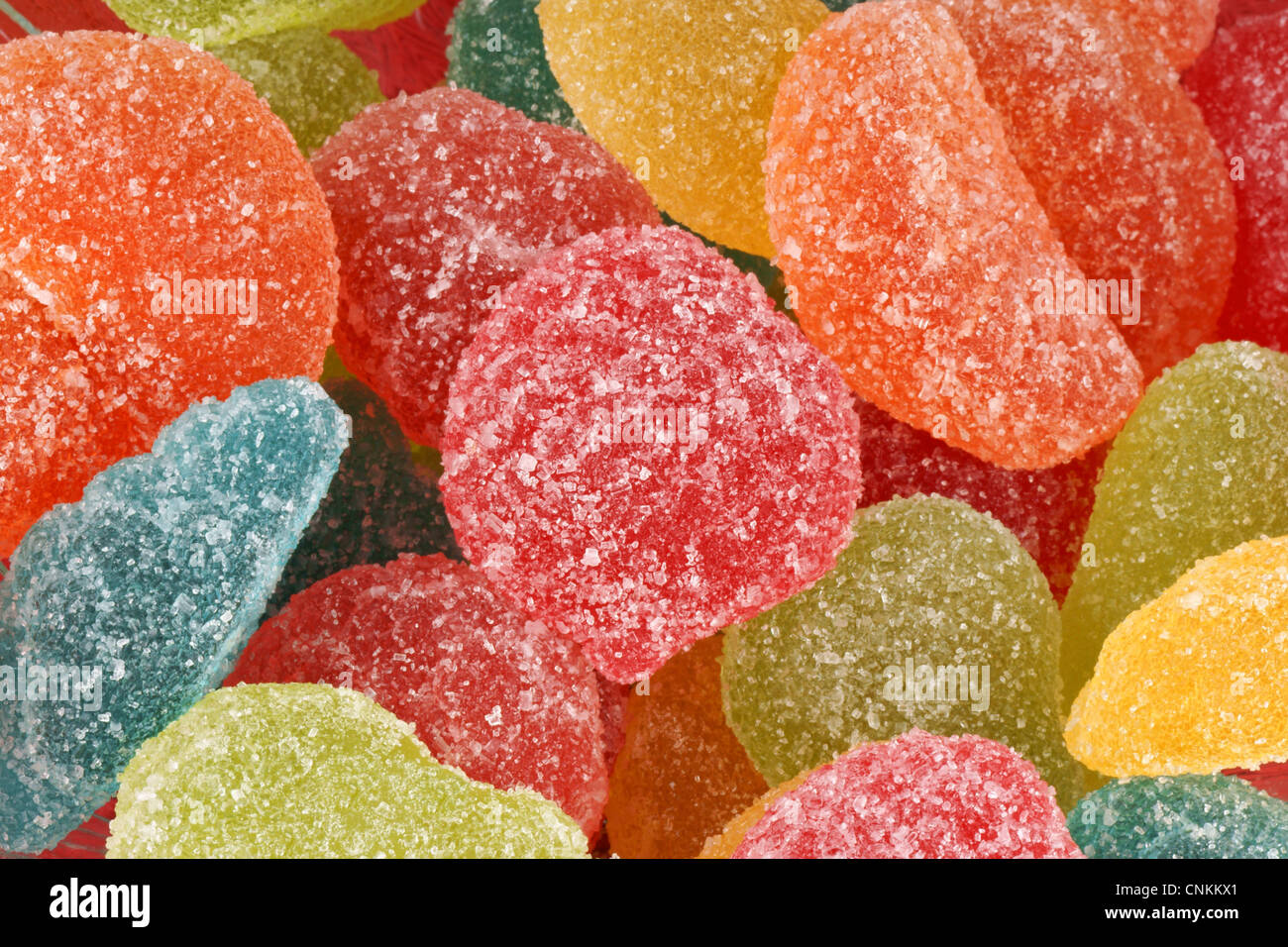 Assorted shaped and flavored fruit jellies background Stock Photo - Alamy