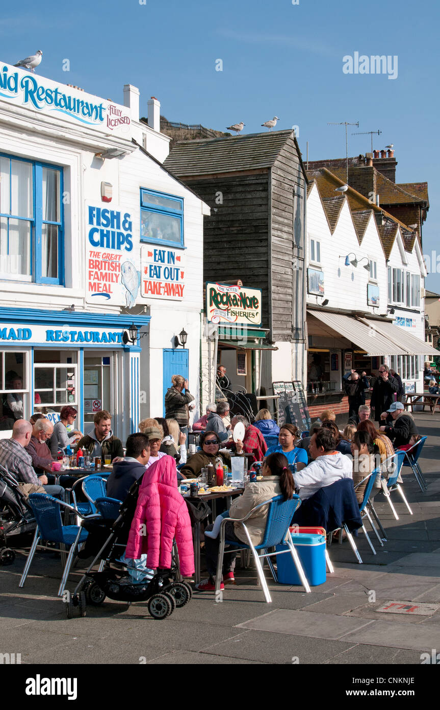 Customers eating a traditional fish & chip lunch in the seaside resort ...