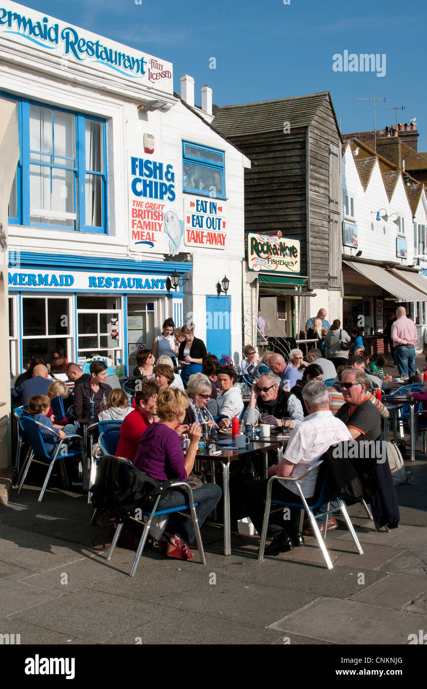 Customers eating a traditional fish & chip lunch in the seaside resort ...