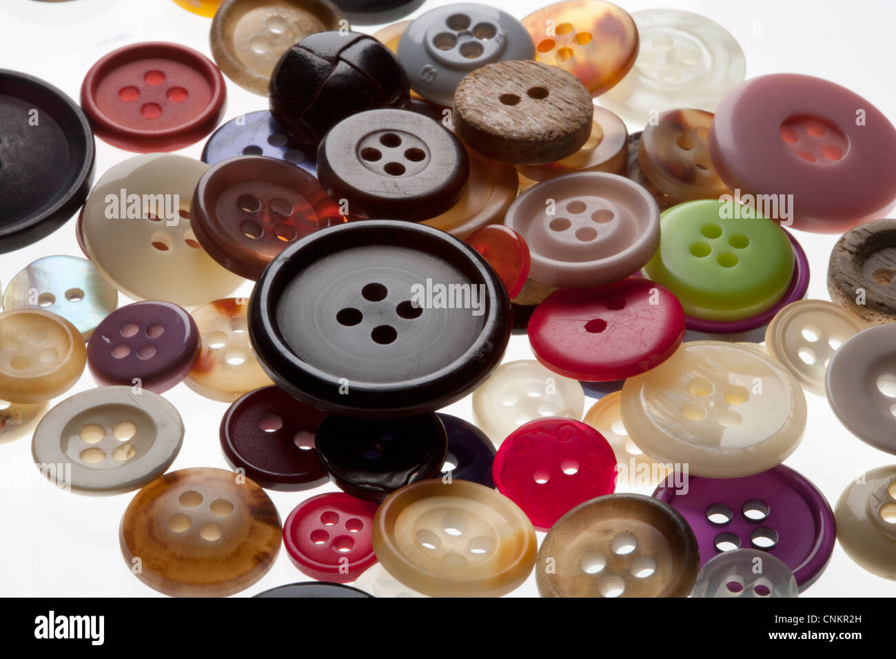 A range of different sized and coloured buttons Stock Photo - Alamy