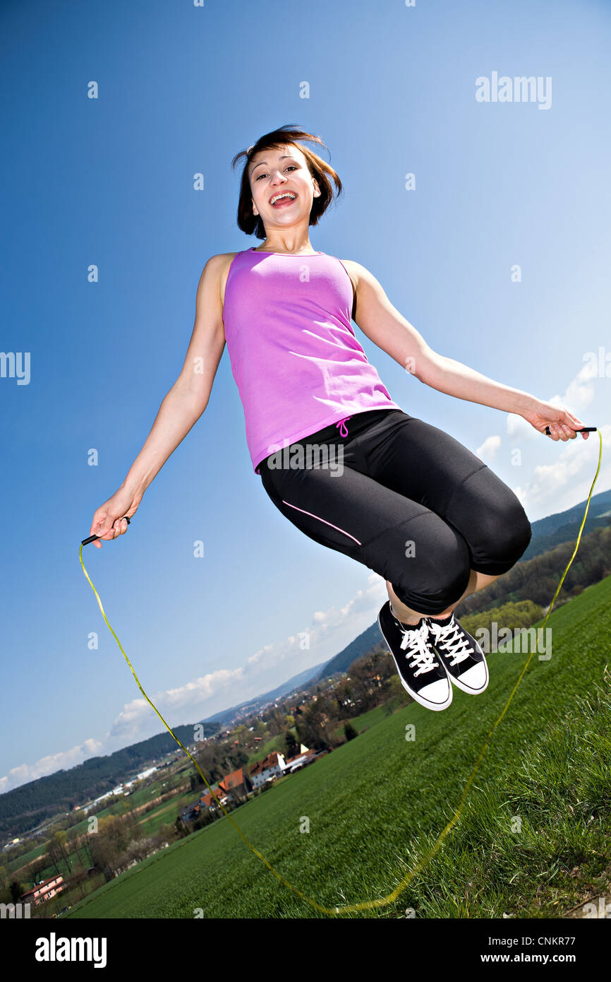 A young woman with a skipping rope Stock Photo - Alamy
