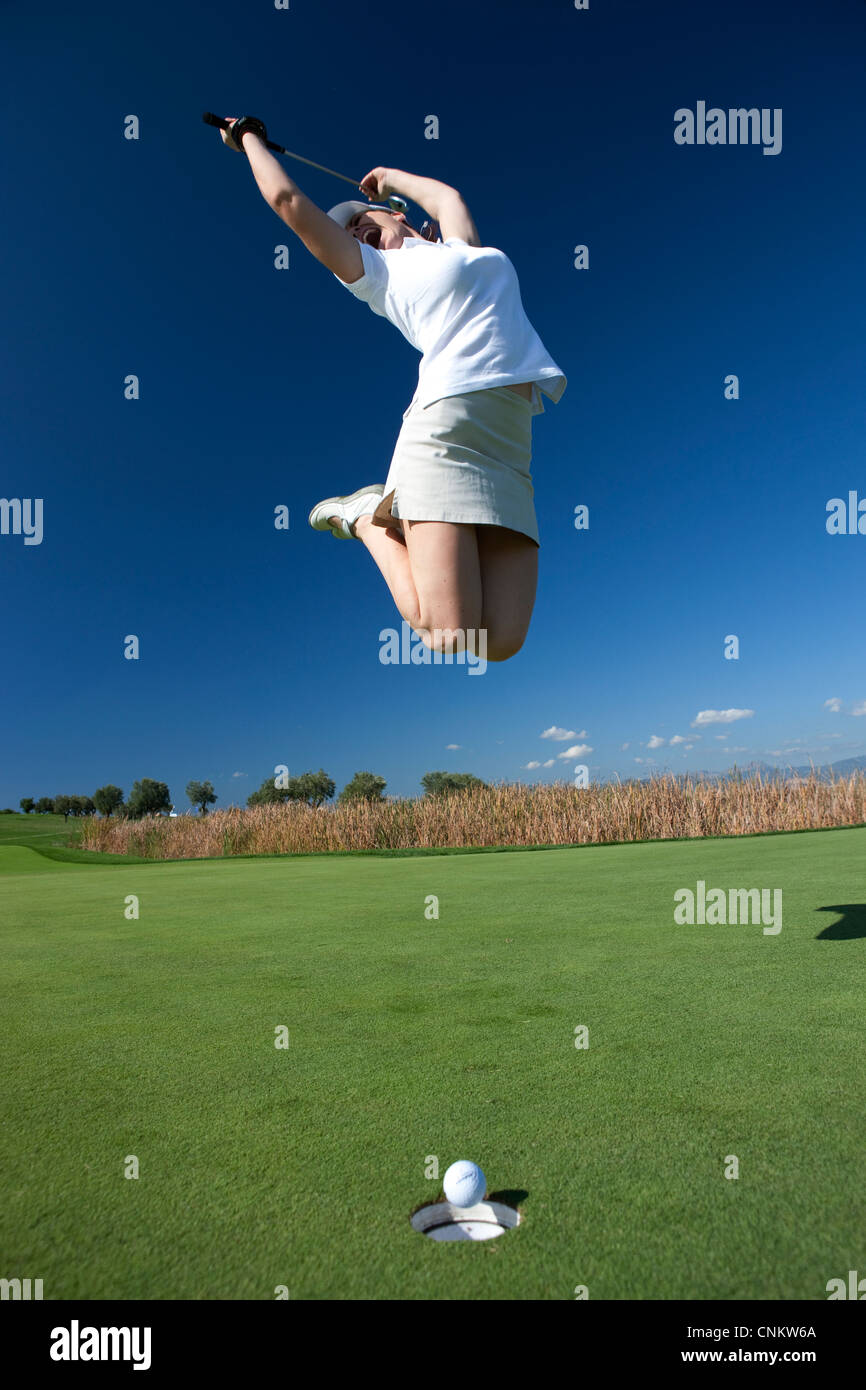 Golfer jumping at green hi-res stock photography and images - Alamy