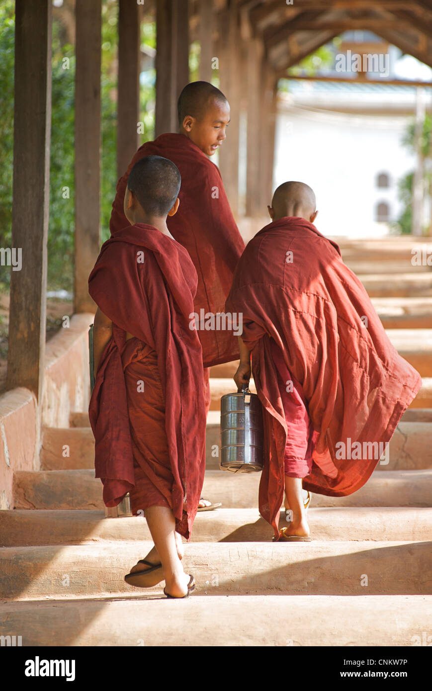 Novice buddhist monks walking down steps from monastery. Kalaw, Burma ...