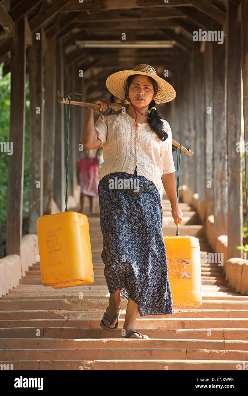 Woman transporting water in buckets to her home. Kalaw. Burma. Myanmar ...