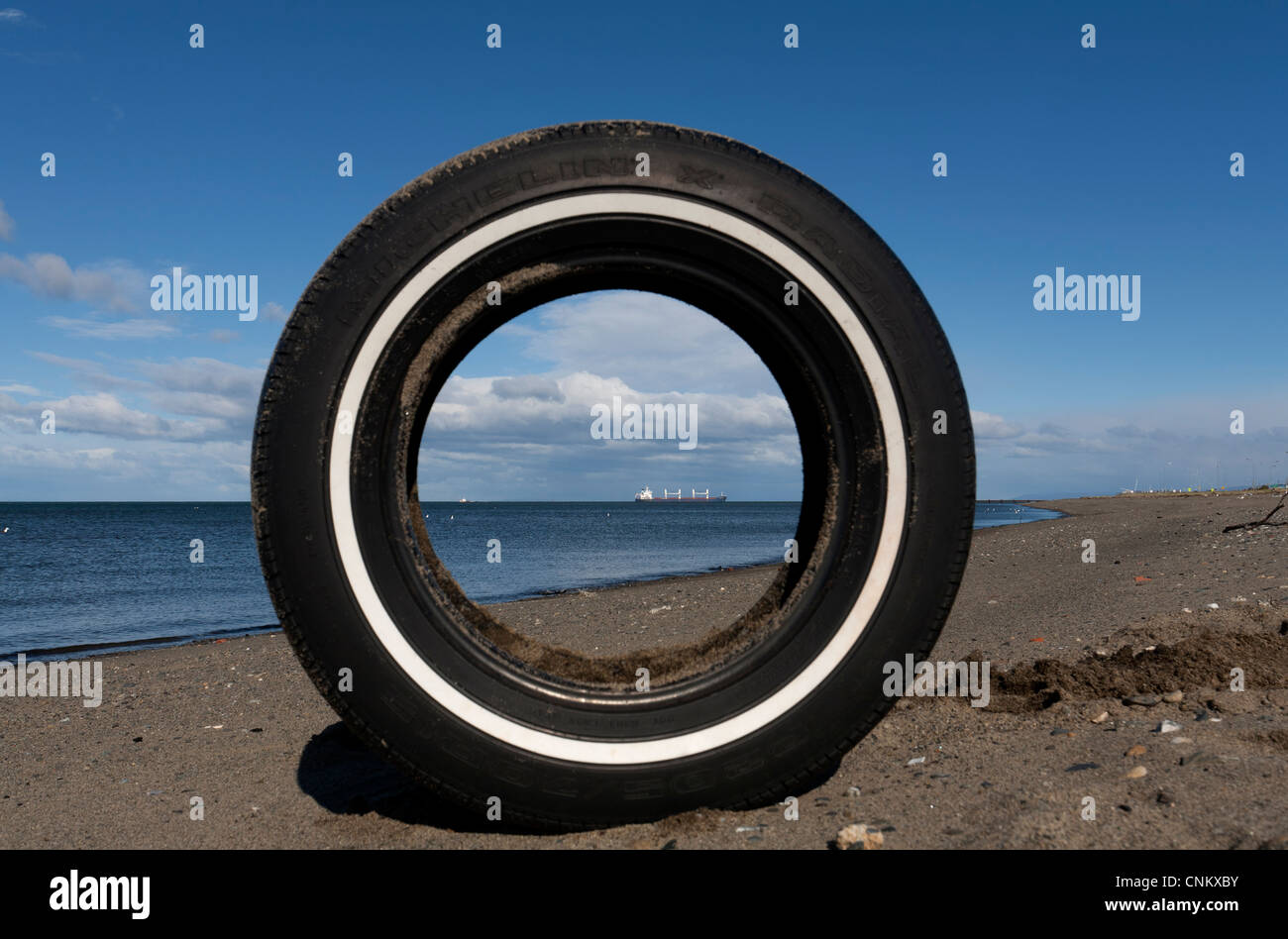 Tire in the beach Stock Photo - Alamy
