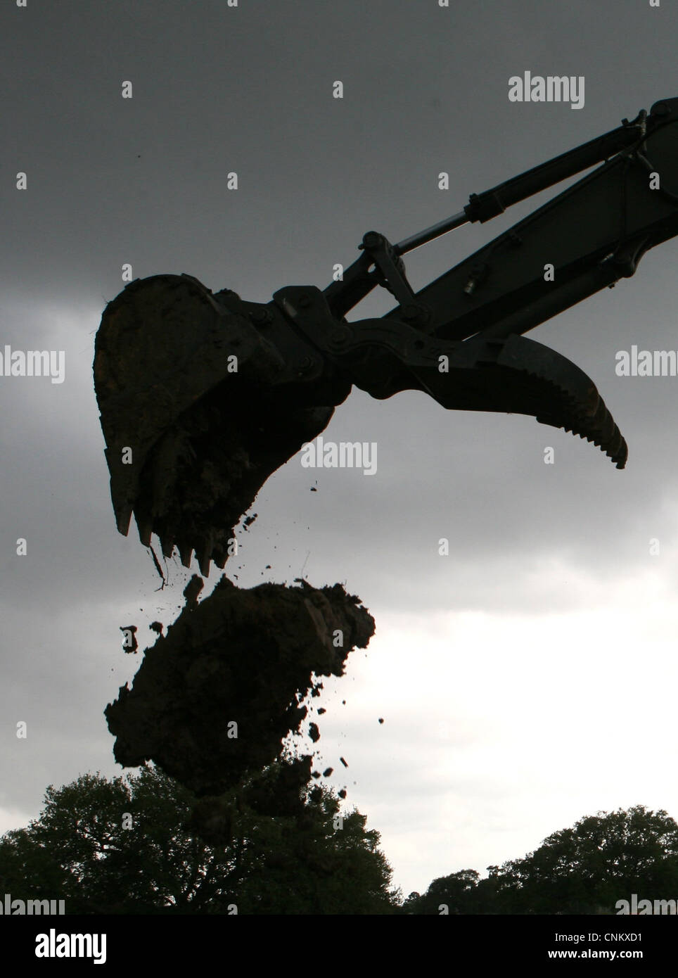 Equipment Operator Third Class Steve Tefft operates a excavator during ...