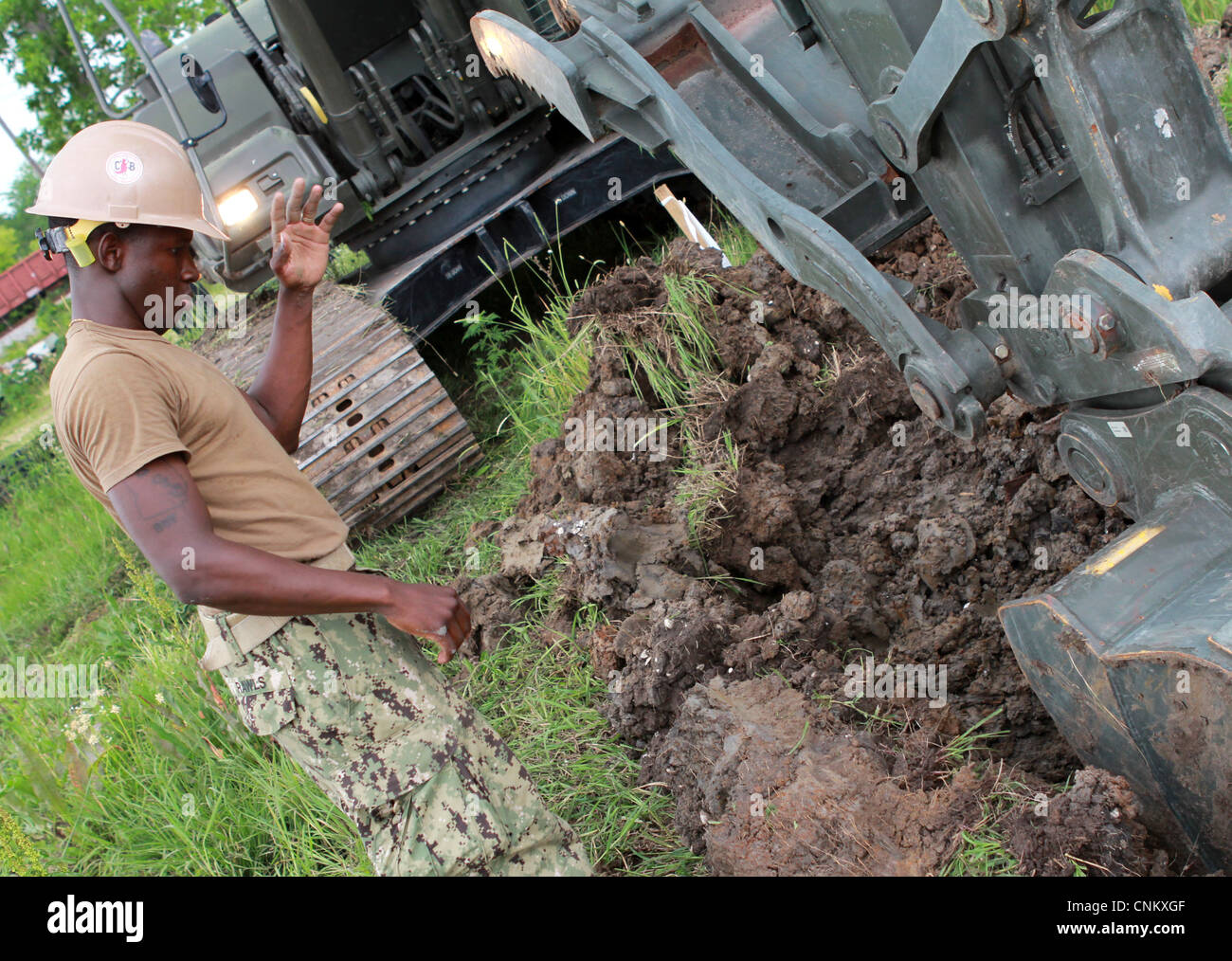 Equipment Operator 3rd Class Christopher Rawls operates an excavator ...
