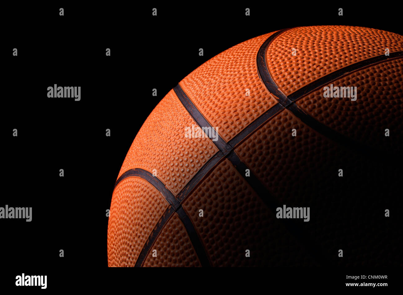 Basket ball in a dark background Stock Photo - Alamy
