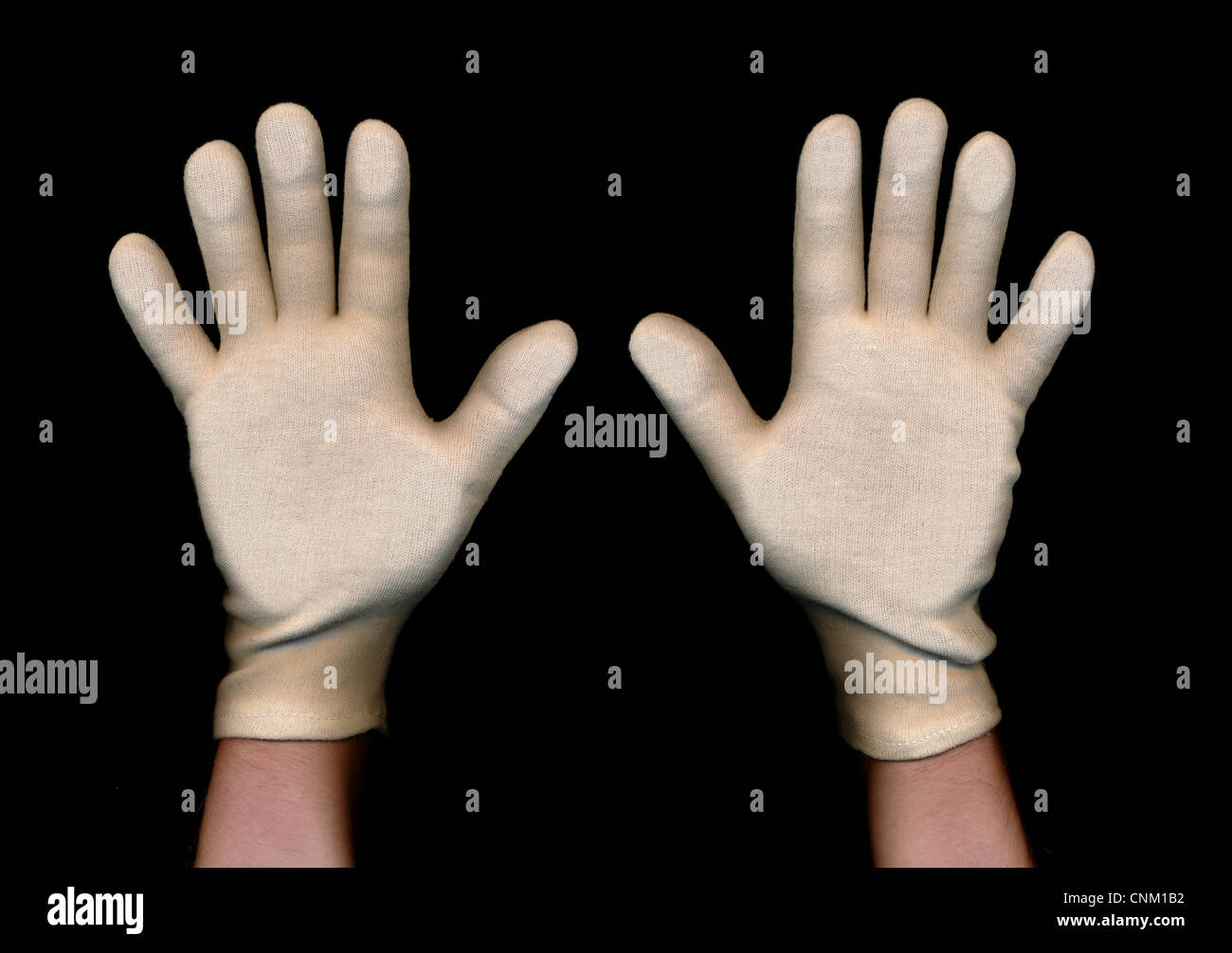 Two hands with white gloves held up to surrender, symbolic photo Stock ...
