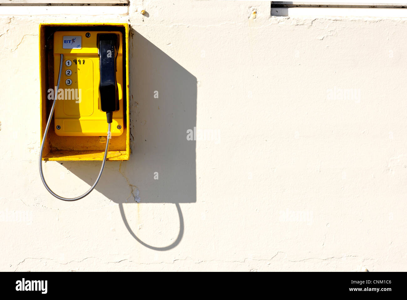 Yellow telephone box hi-res stock photography and images - Alamy