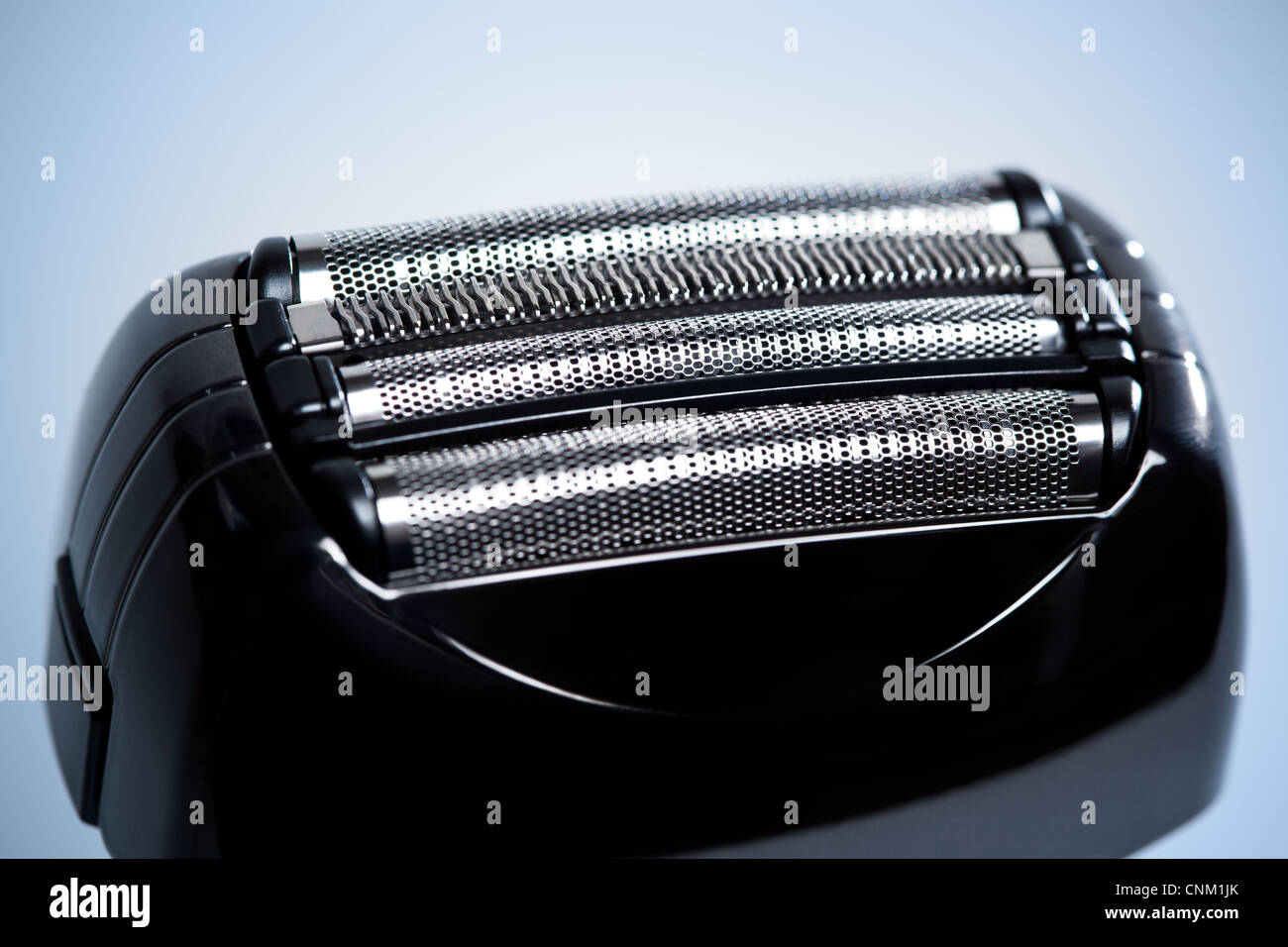 Modern electric razor close-up. On soft white and blue background Stock ...