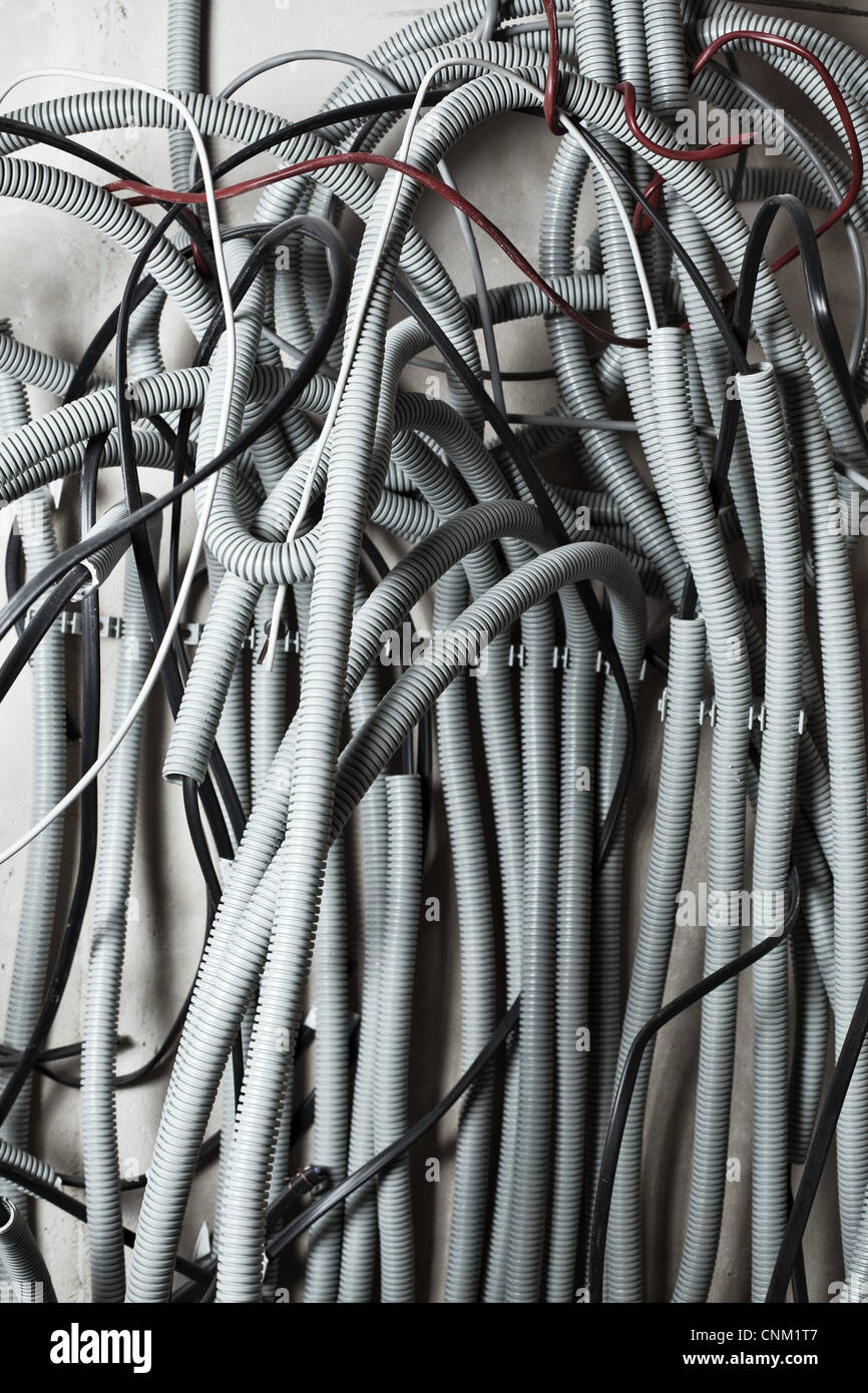 Electric wires on wall in renovation room Stock Photo - Alamy