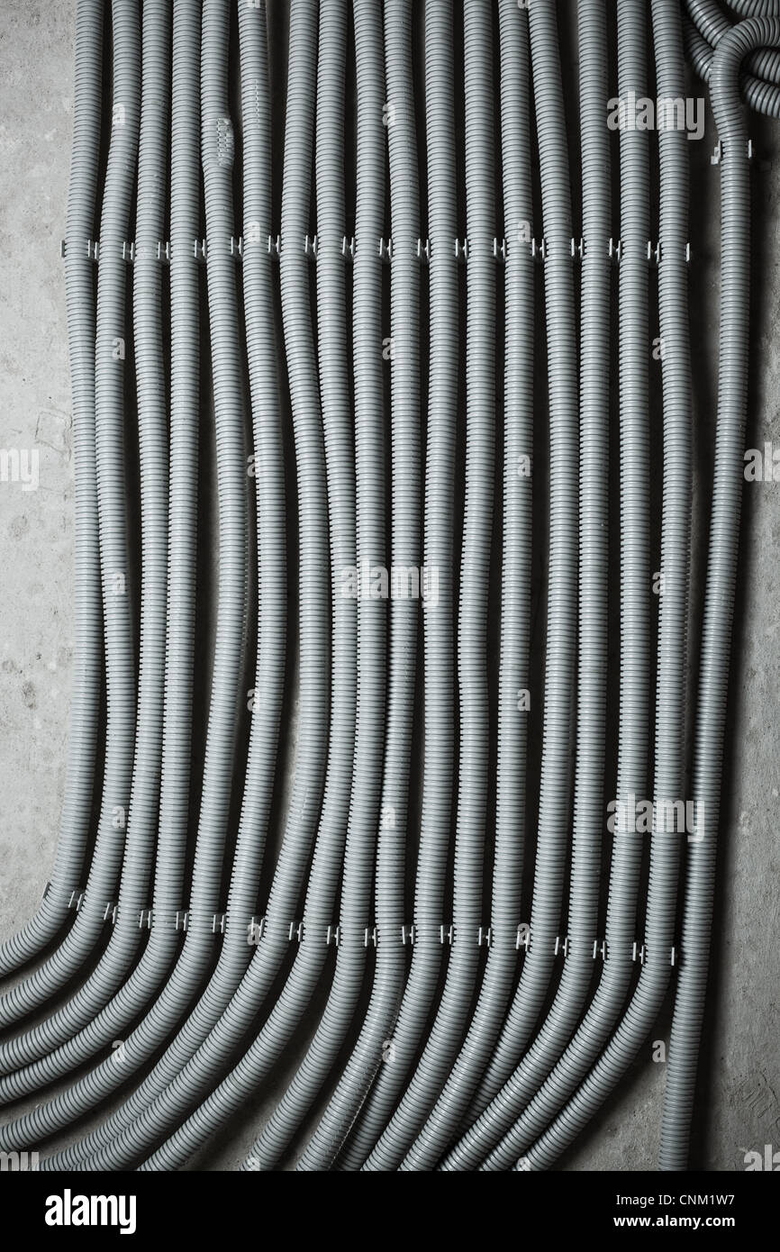 Electric wires on wall background Stock Photo - Alamy