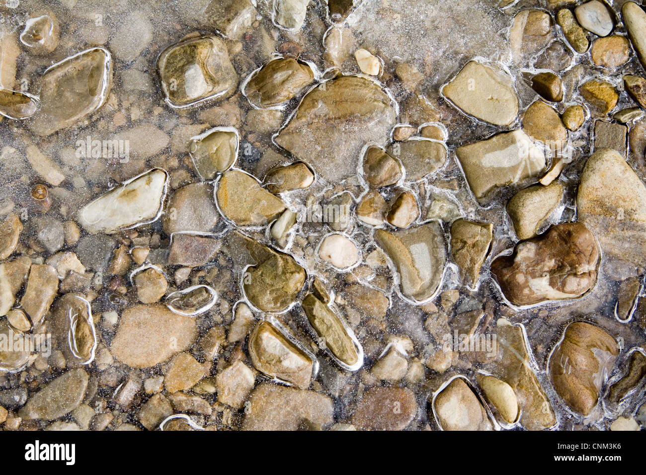 Stones in thin Ice, pattern Stock Photo - Alamy