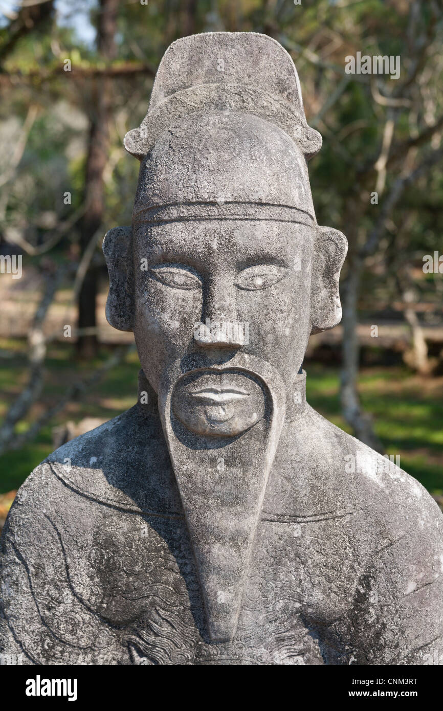 A stone statue of a man at the tomb of Emperor Tu Duc, near Hue ...