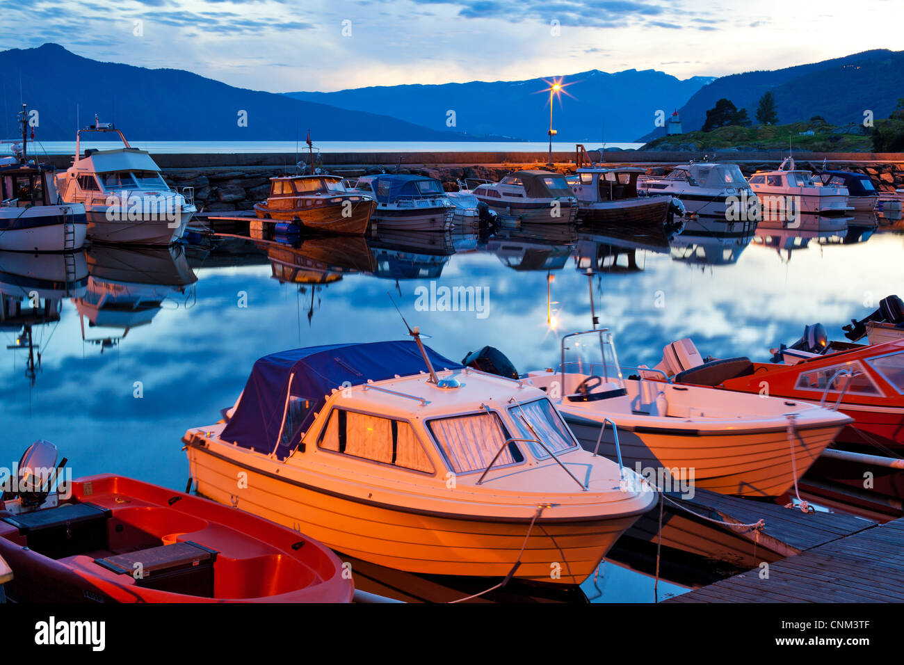 Boats on a moorage. Twilight landscape Stock Photo - Alamy