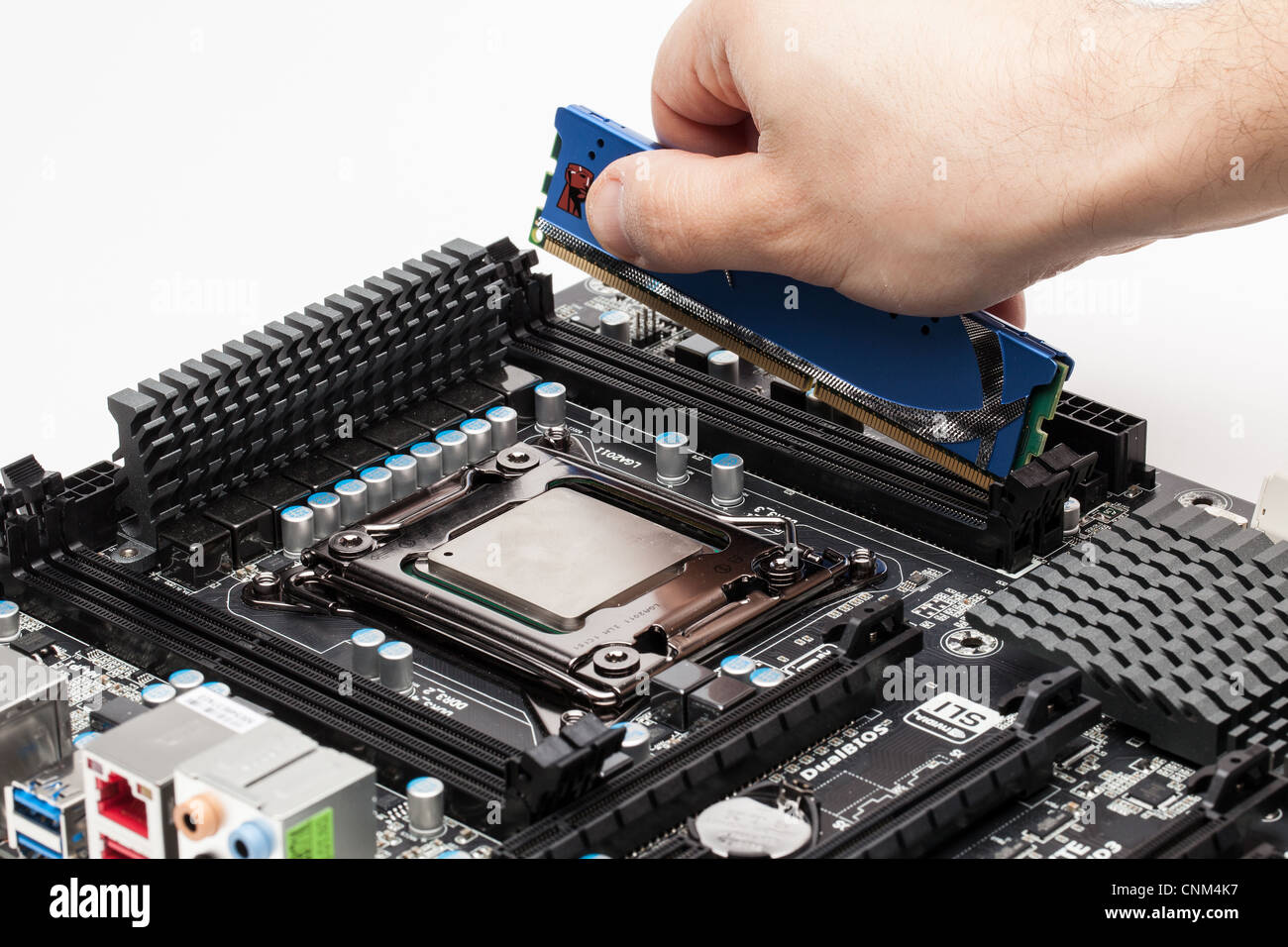 Memory module installation on a computer motherboard Stock Photo - Alamy