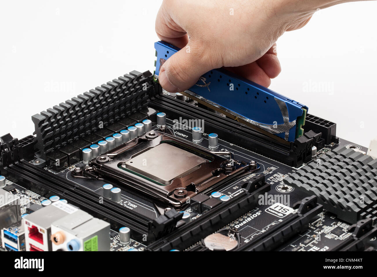 Memory module installation on a computer motherboard Stock Photo - Alamy