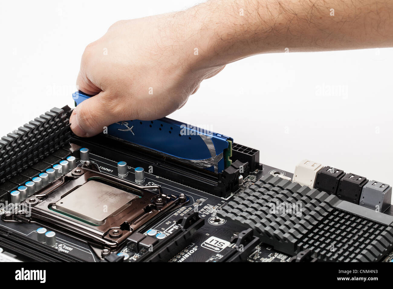 Memory module installation on a computer motherboard Stock Photo - Alamy