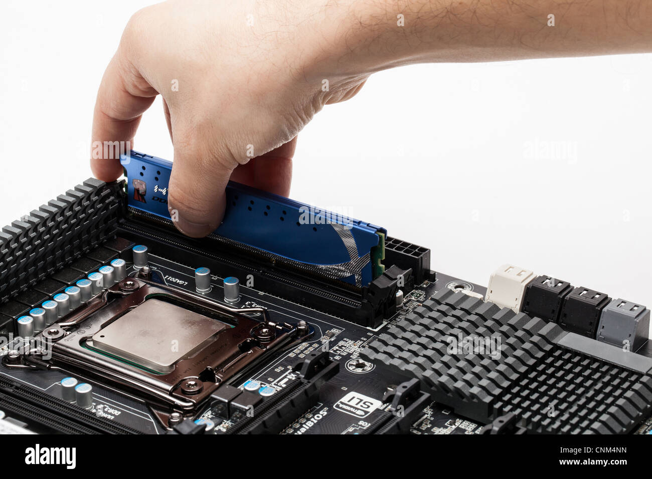 Memory module installation on a computer motherboard Stock Photo - Alamy