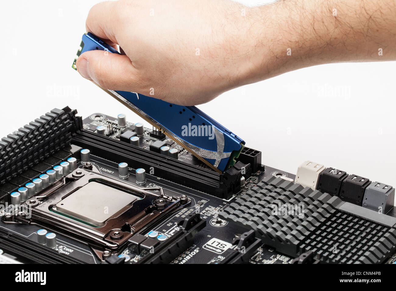 Memory module installation on a computer motherboard Stock Photo - Alamy