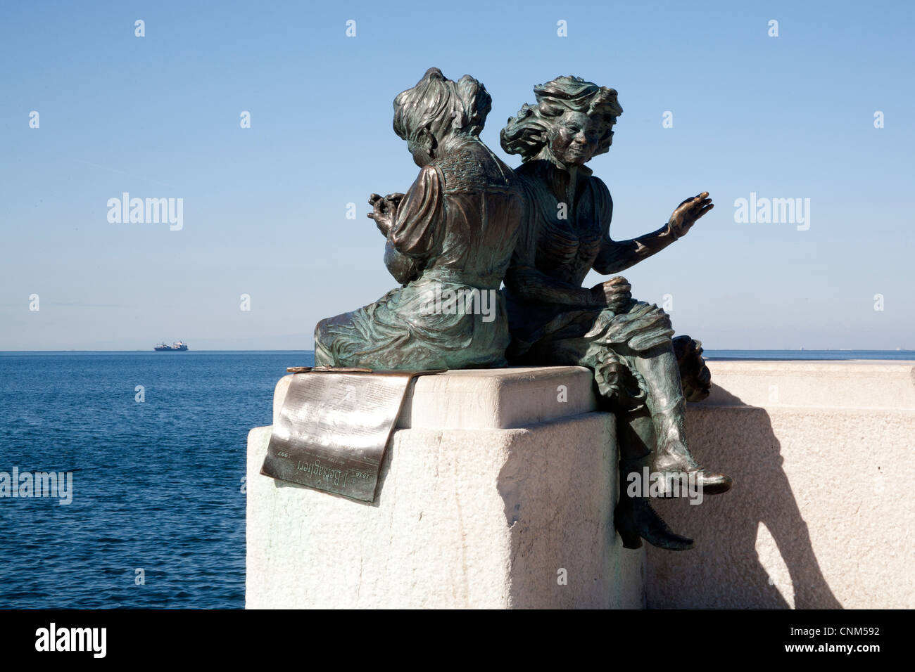 Bronze statues on the waterfront of women sewing, Piazza dell'Unita ...