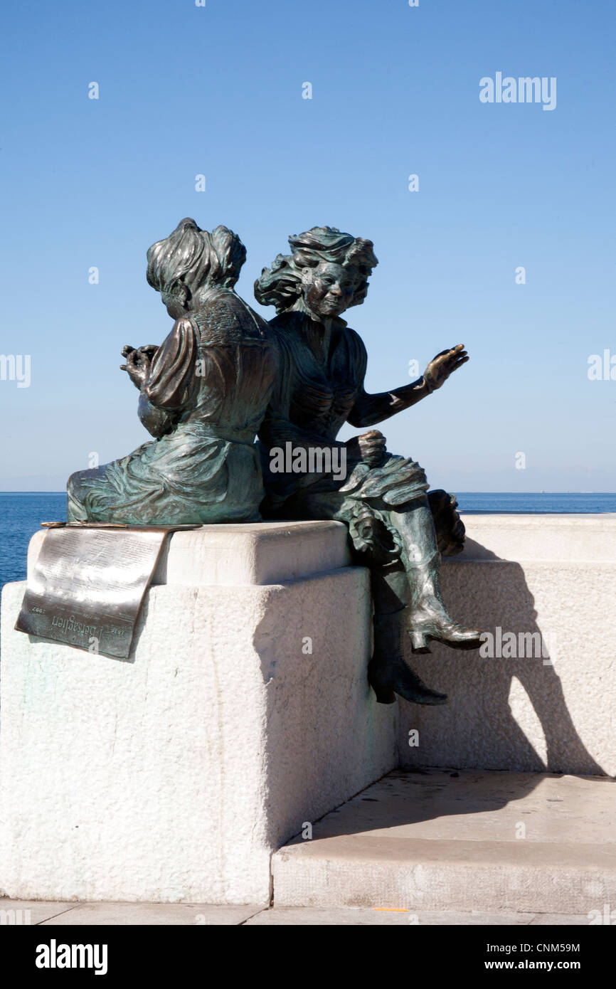 Bronze statues on the waterfront of women sewing, Piazza dell'Unita ...