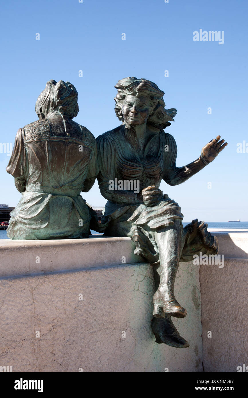 Bronze statues on the waterfront of women sewing, Piazza dell'Unita ...