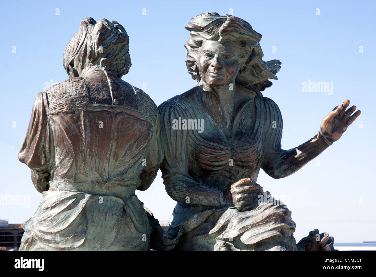Bronze statues on the waterfront of women sewing, Piazza dell'Unita ...